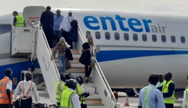 1st tourist flight arrives with 164 on board - The Point
