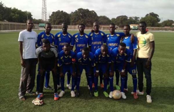 Fortune FC lift Access to Justice championship trophy - The Point